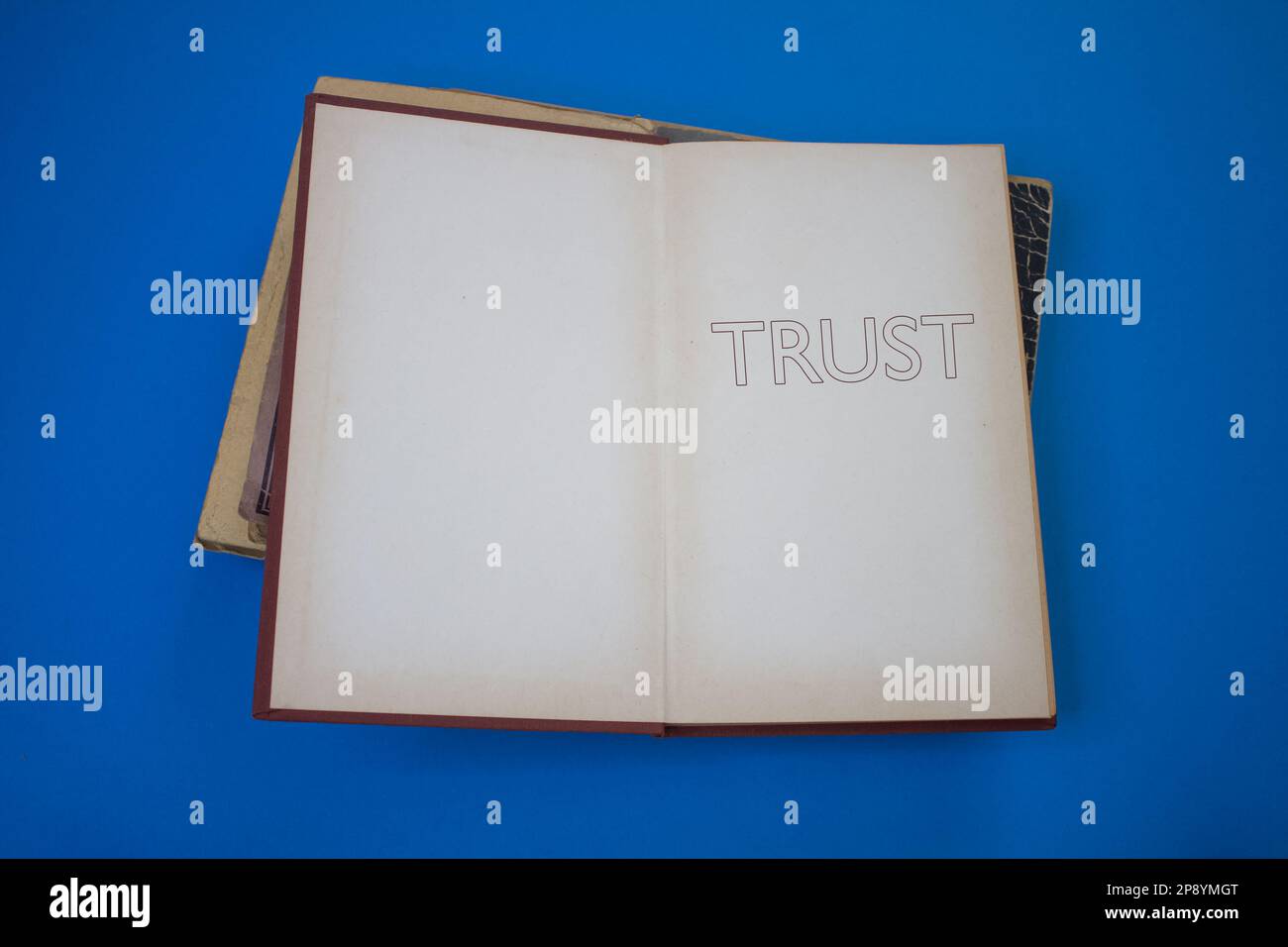 Trust word in opened book with vintage, natural patterns old antique ...