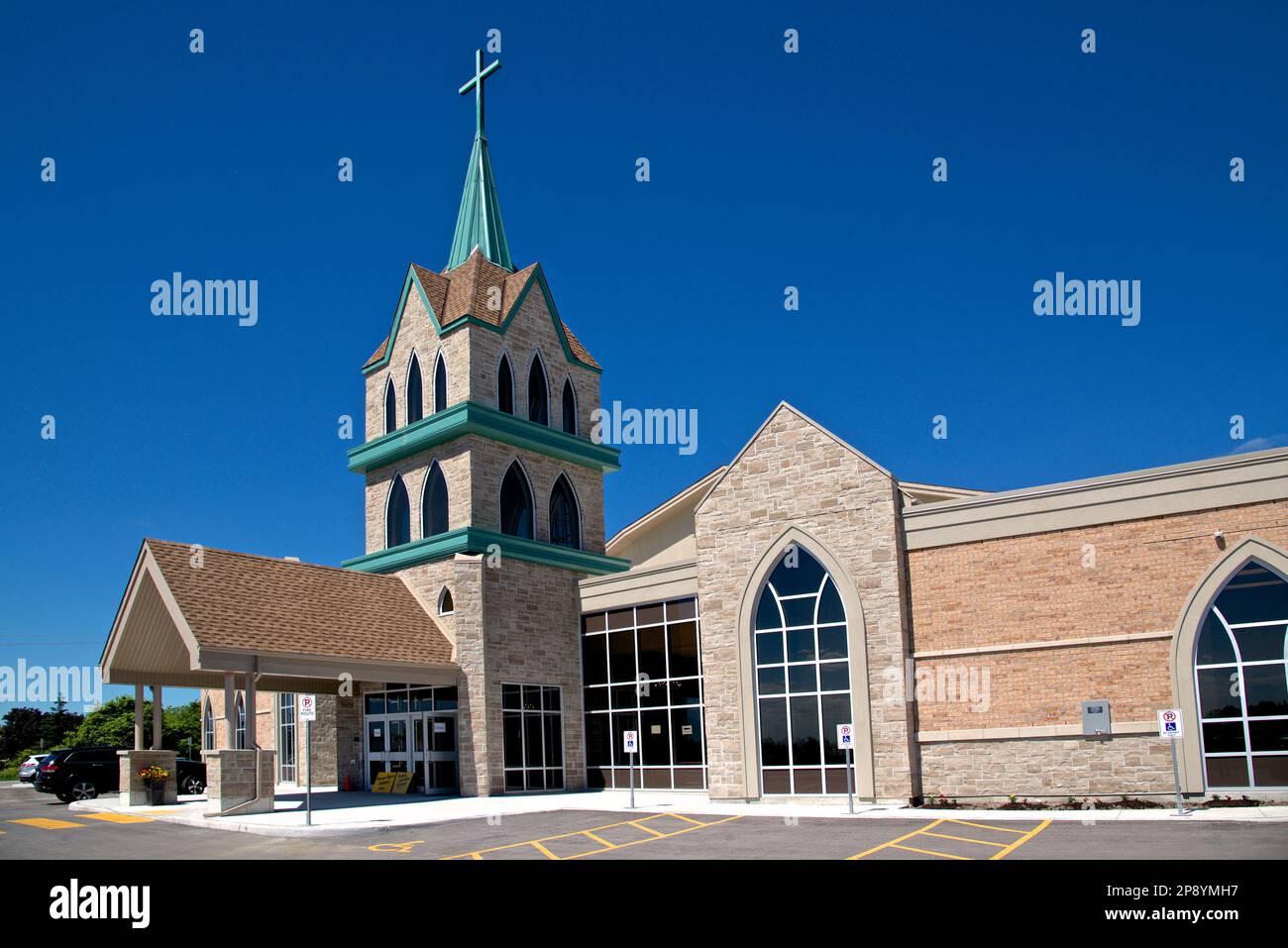 The exterior of a church with a clear blue sky Stock Photo - Alamy
