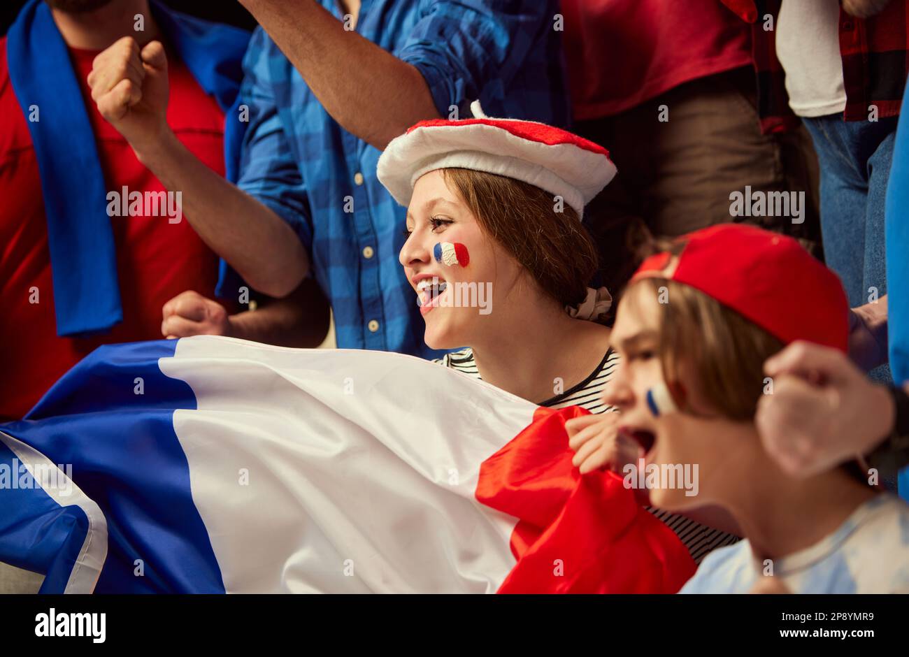 Football, soccer fans, men and women with countries flags emotionally ...
