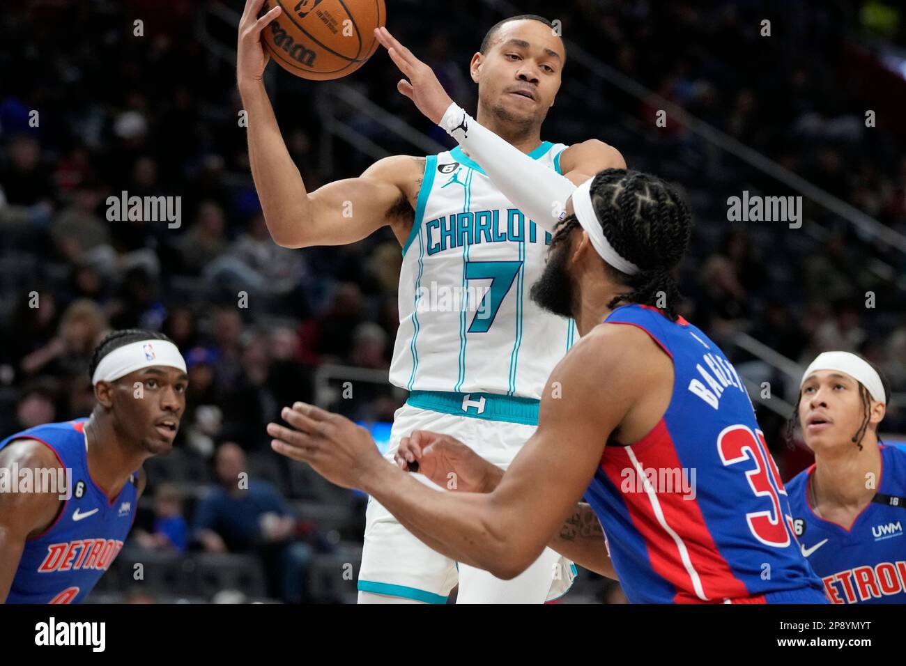 Charlotte Hornets guard Bryce McGowens (7) grabs a rebound next to ...