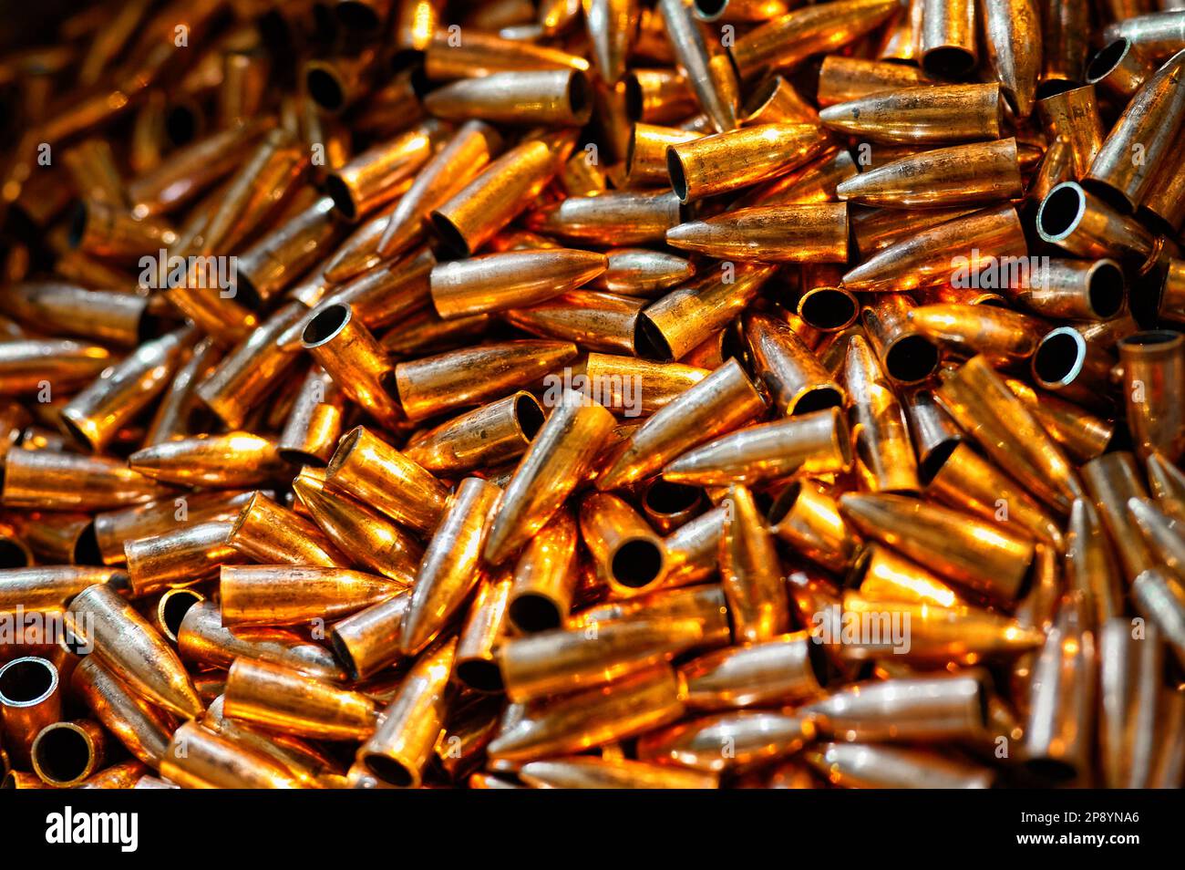 Large caliber copper shells pile for riffle as background Stock Photo ...
