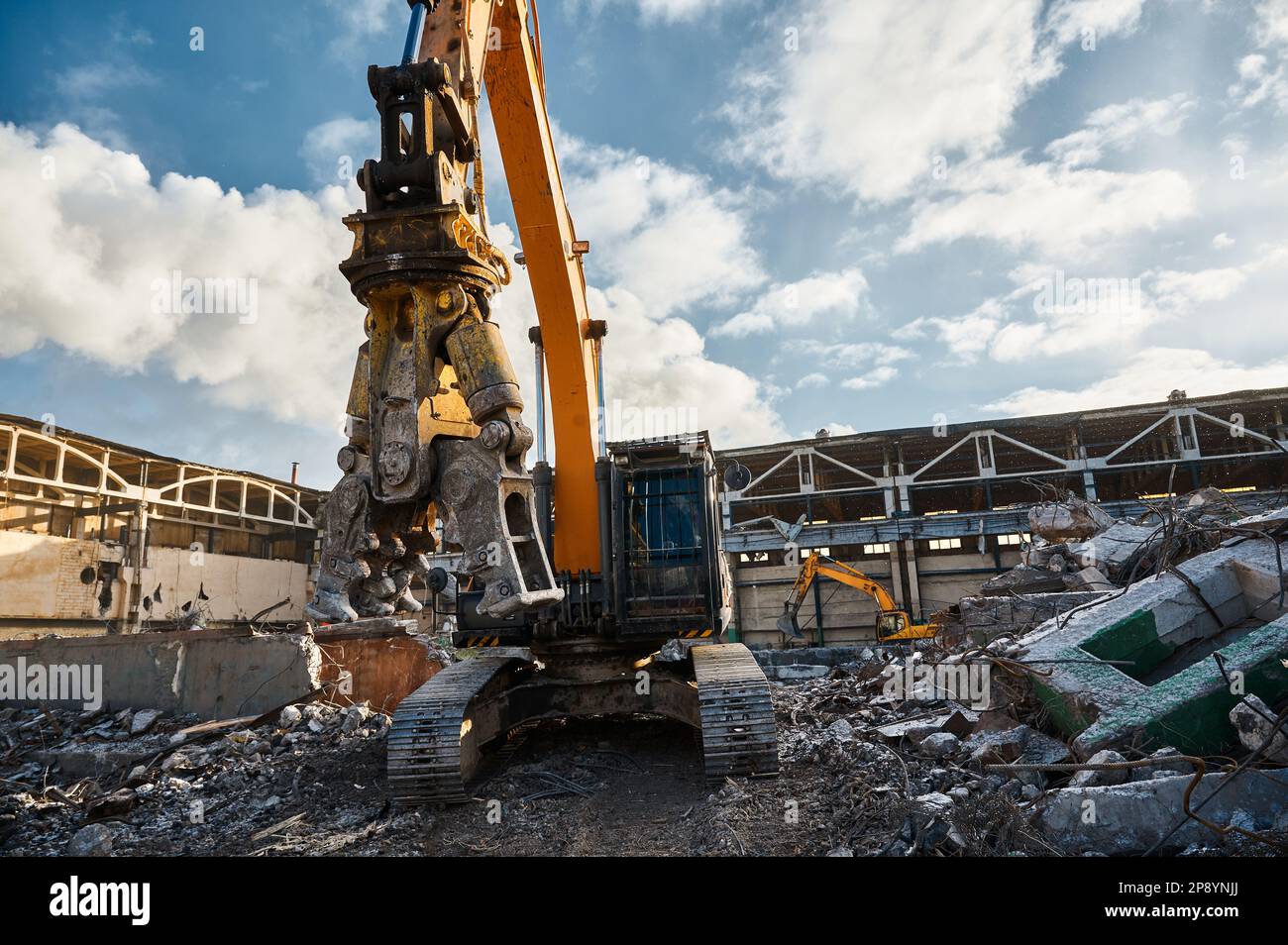 Excavator with hydraulic scissors demolition site Stock Photo - Alamy