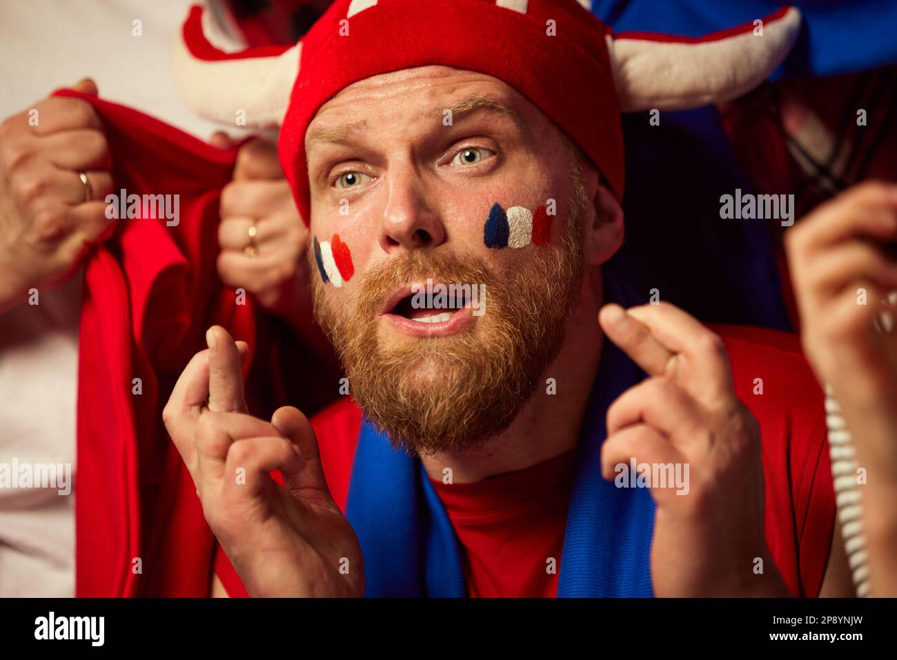 Tense game moment. Football, soccer fan, man emotionally watching match ...