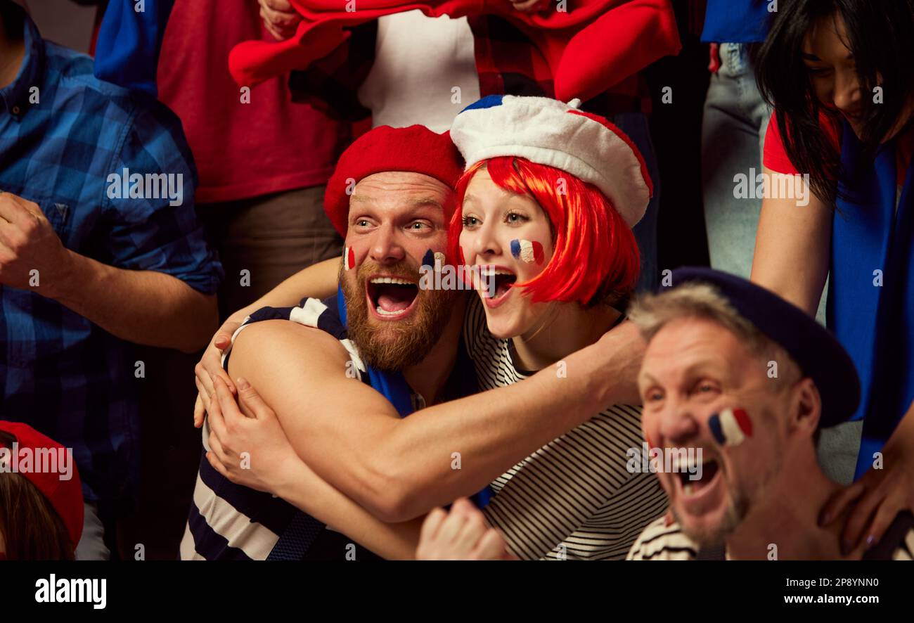 Happiness. Football, soccer fans emotionally cheering up favourite ...