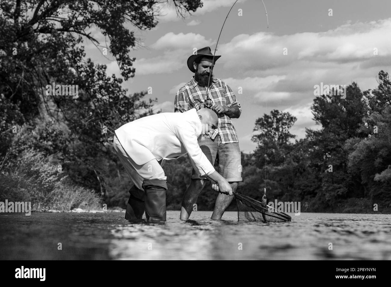 Fisherman in formal suit. Portrait two men on holiday. Men relaxing ...