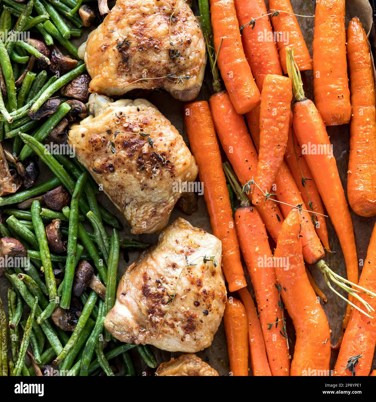 Top down close up view of a one pan meal of chicken thighs and ...