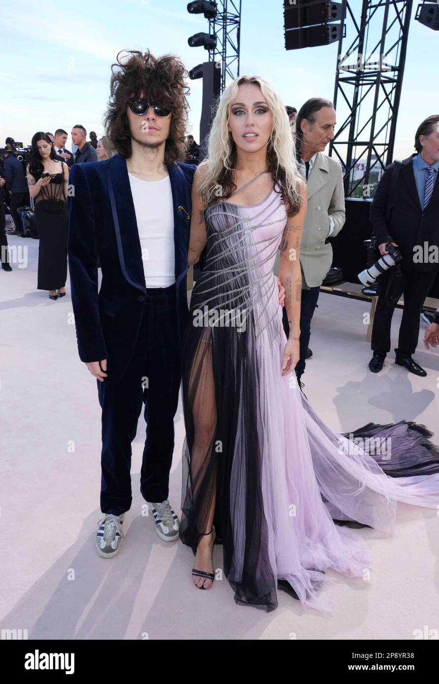 Miley Cyrus, right, and Maxx Morando attend the Versace Fall/Winter ...