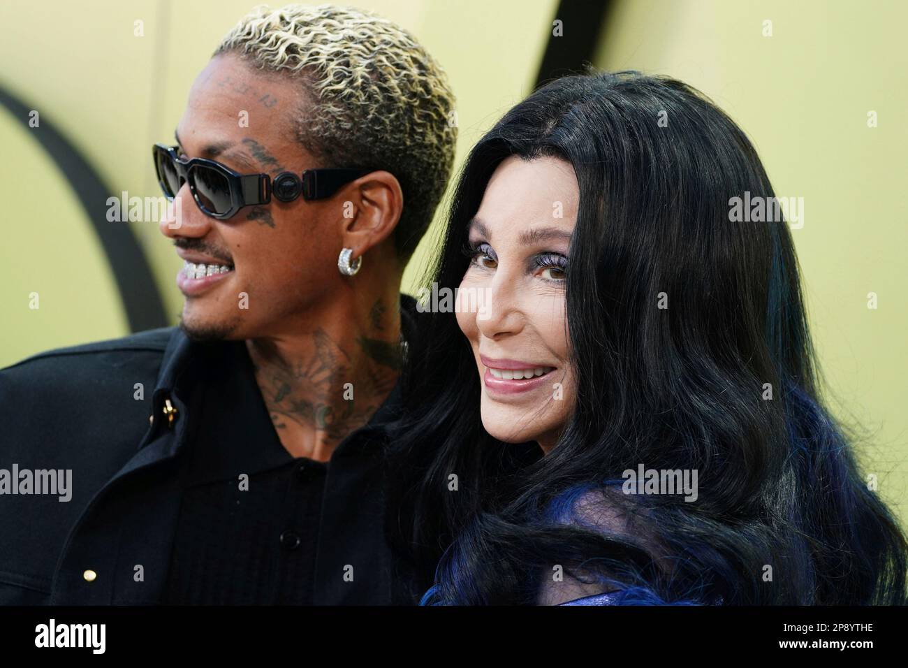 Alexander Edwards, left, and Cher arrive at the Versace Fall/Winter ...