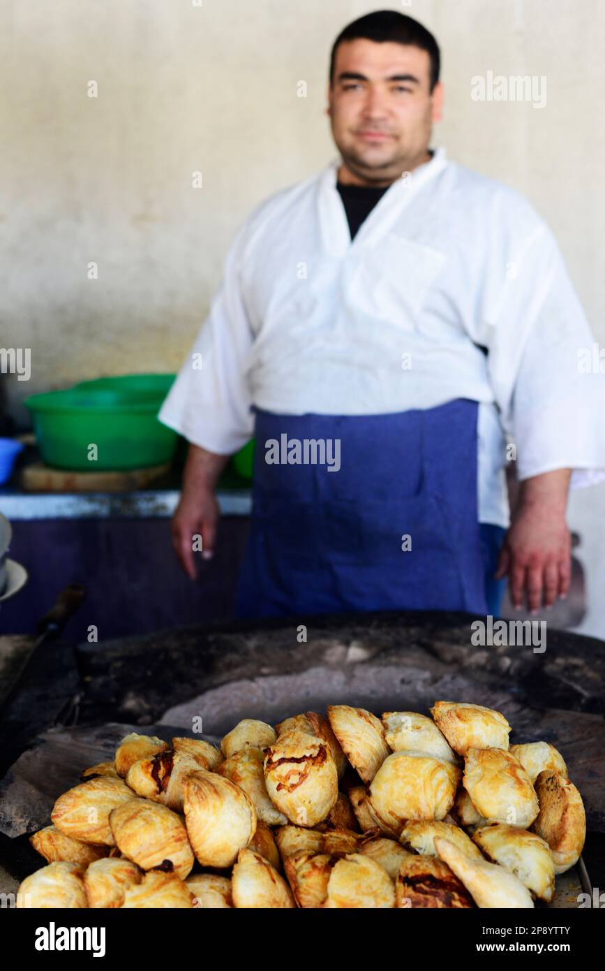 Uzbek Samsa ( flaky baked meat buns ) baked in a tandoor oven is a ...