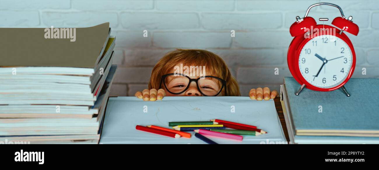 Time to learn concept. School kids against green chalkboard. Learning ...