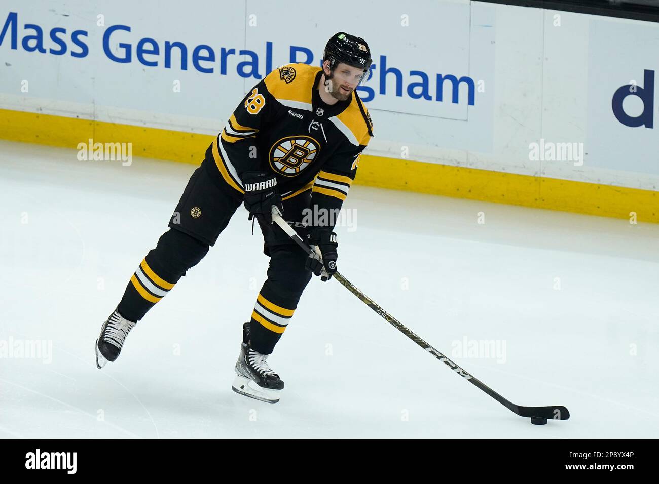 Boston Bruins defenseman Derek Forbort (28) warms up before an NHL ...