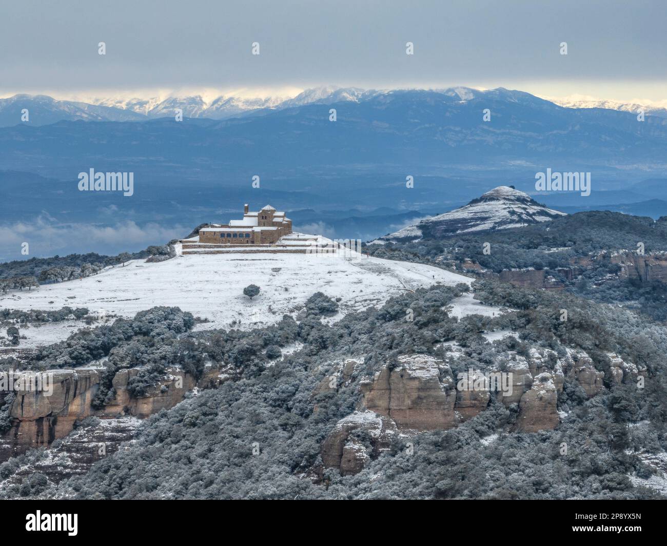 Aerial view of the snowy peaks of Montcau and La Mola (with the ...