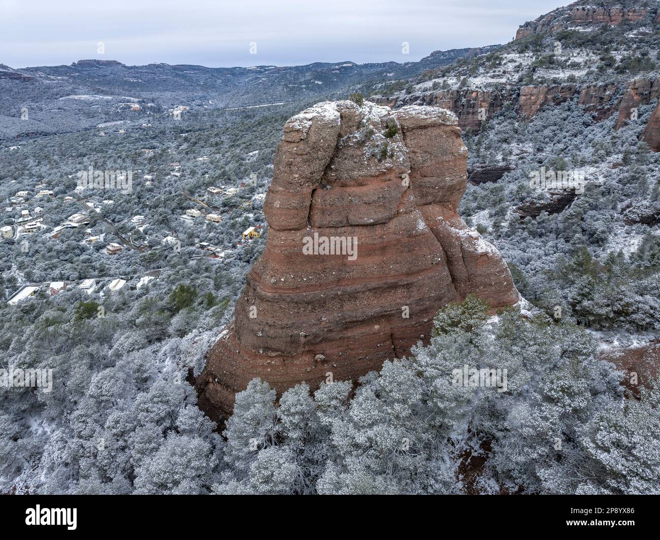 Aerial view of the snowy Cavall Bernat of Matadepera rock, in La Mola ...