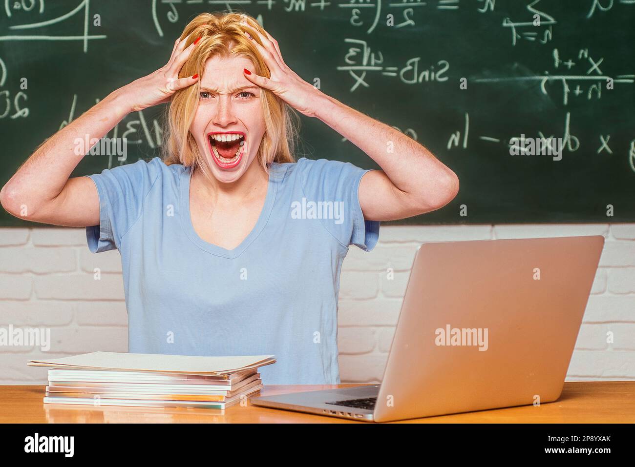 Tired student. Teachers day. Young female student ready to write exam ...