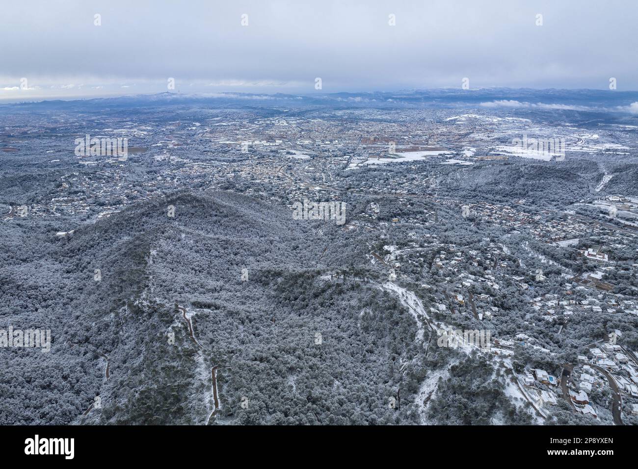 Aerial view of the snowy cities of Matadepera and Terrassa after the ...