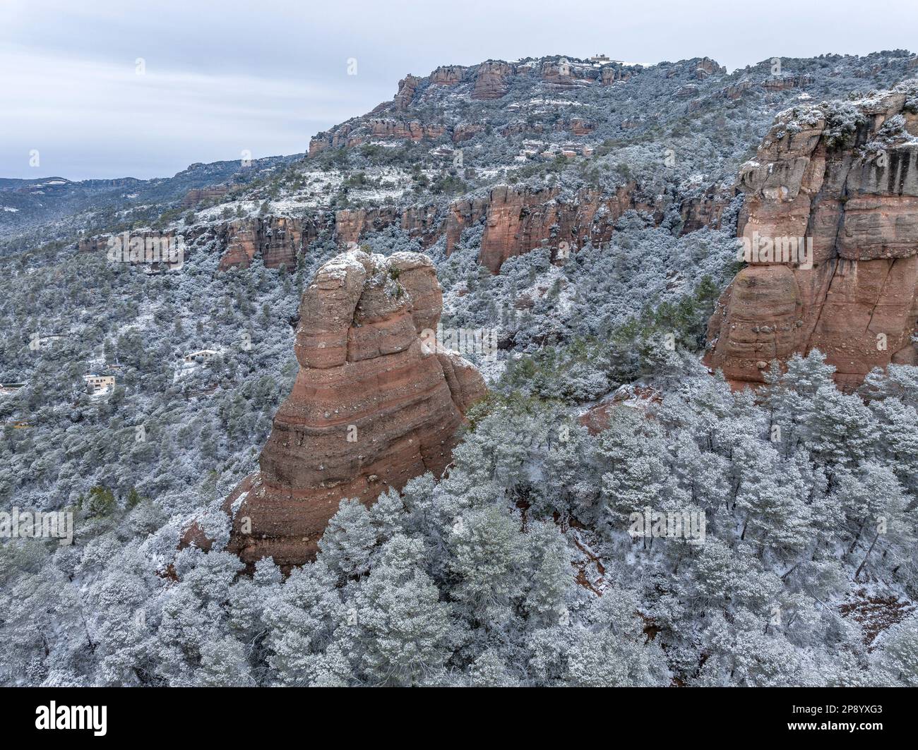Aerial view of the snowy La Mola mountain and the Cavall Bernat de ...