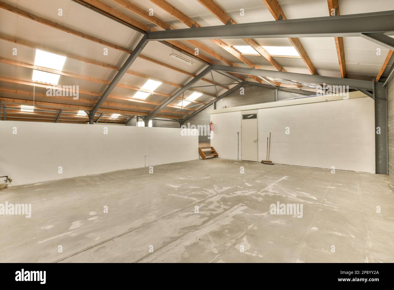 the inside of a building with unfinished walls and wood beams in place ...