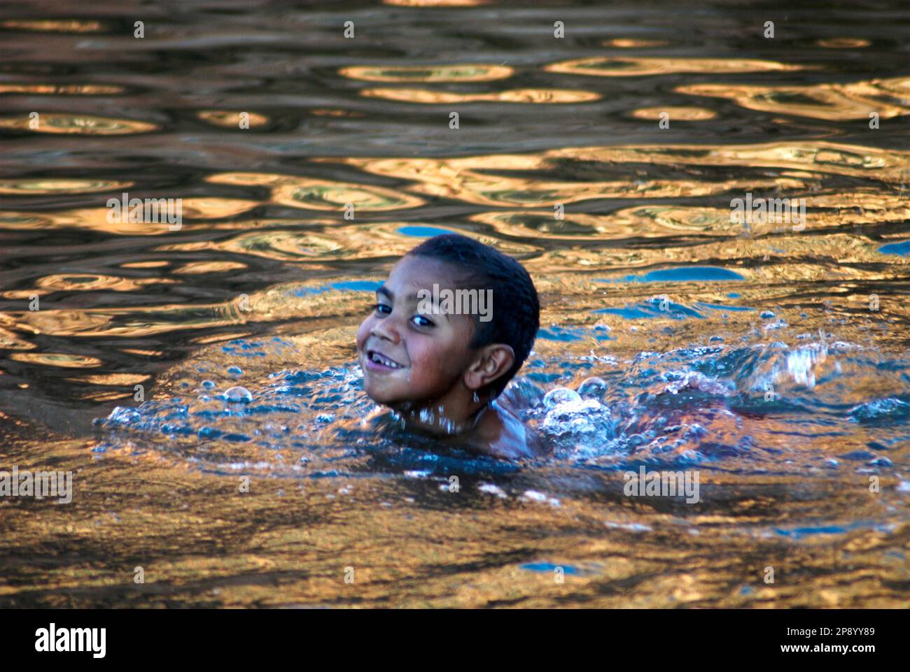 Aboriginal boy swimming at Glen Helen, MacDonnell Ranges, Central ...