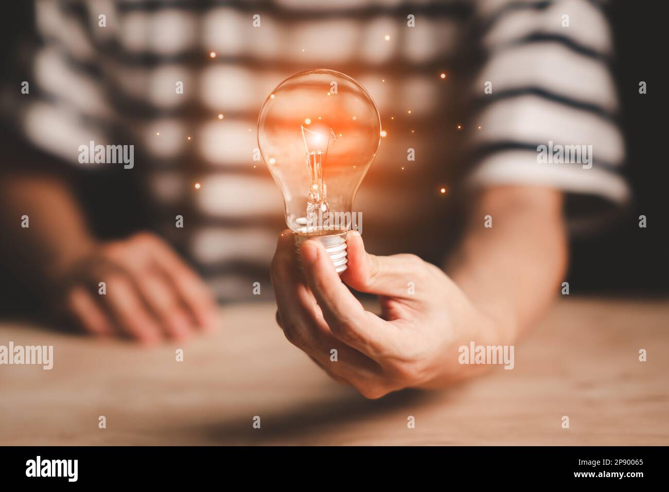 Businessman hand hold lightbulb,Science communication. Global Internet ...