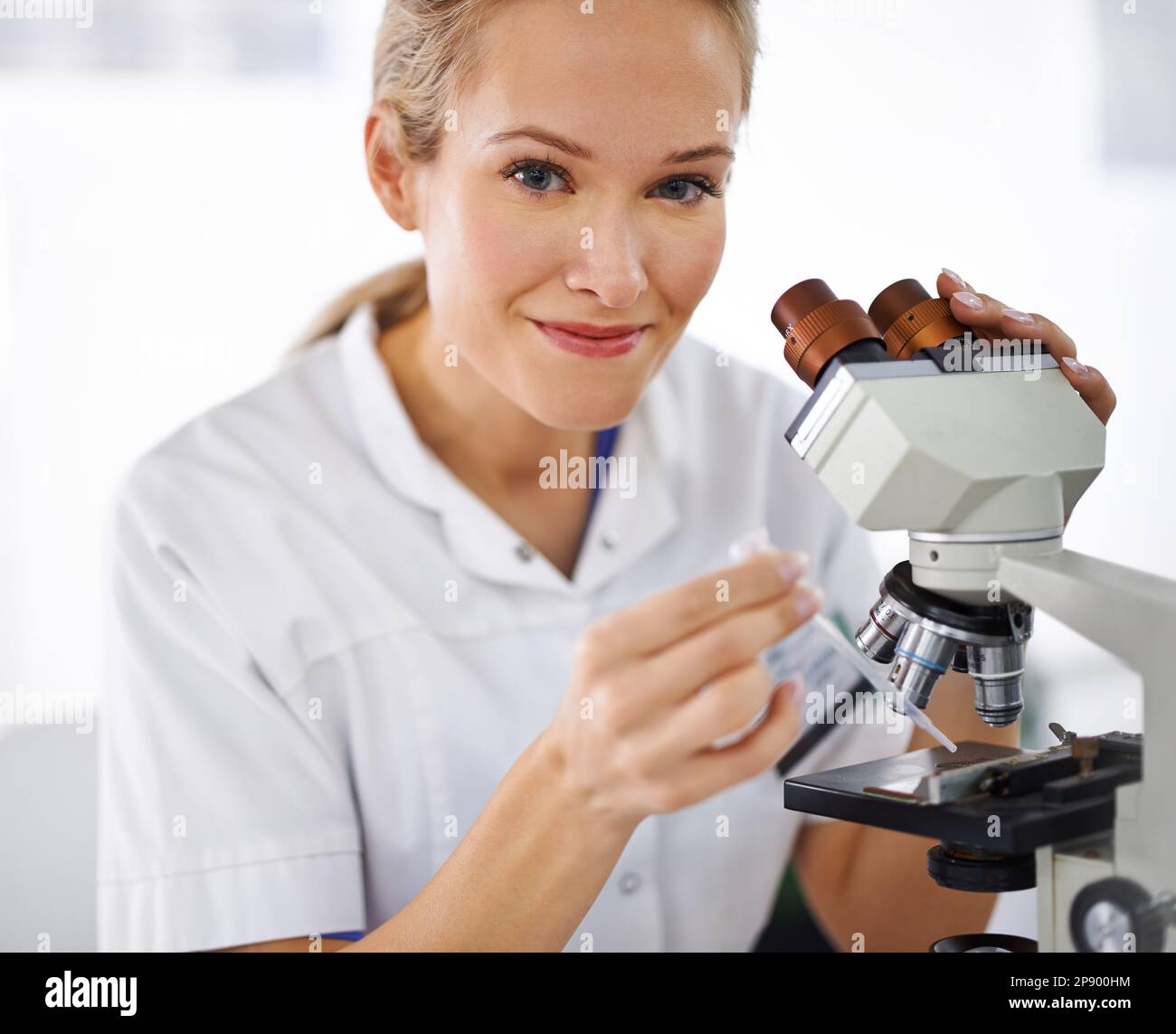 Beautiful biologist. a beautiful woman in a laboratory working with a ...