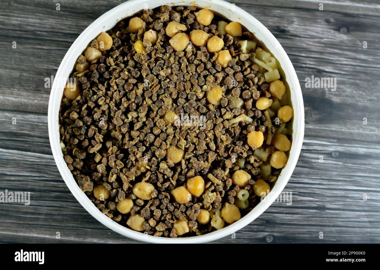 Egyptian cuisine of Koshary, a popular street food made of rice ...