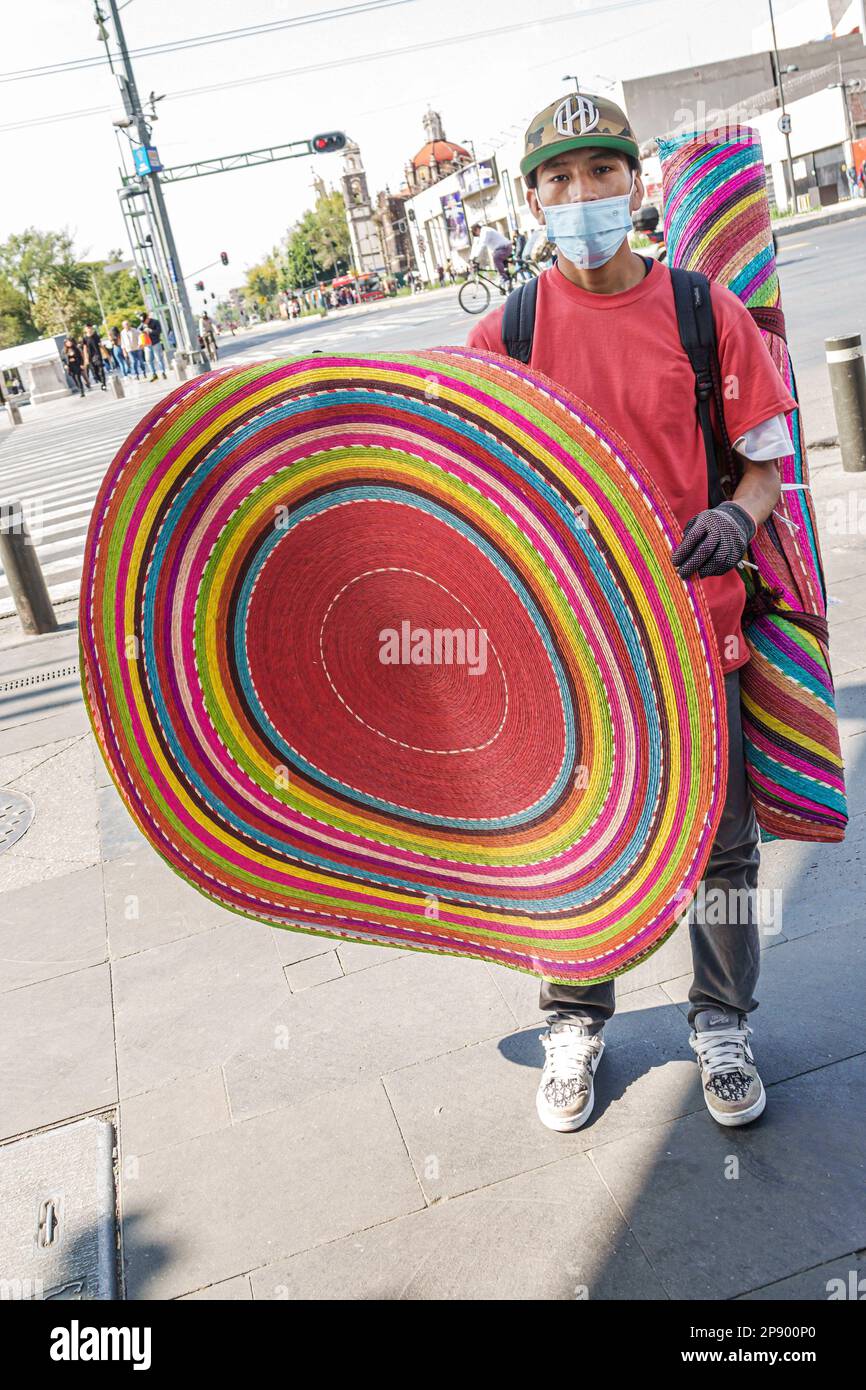 Mexico City,round straw palm hand-woven rug,displaying showing,man men ...