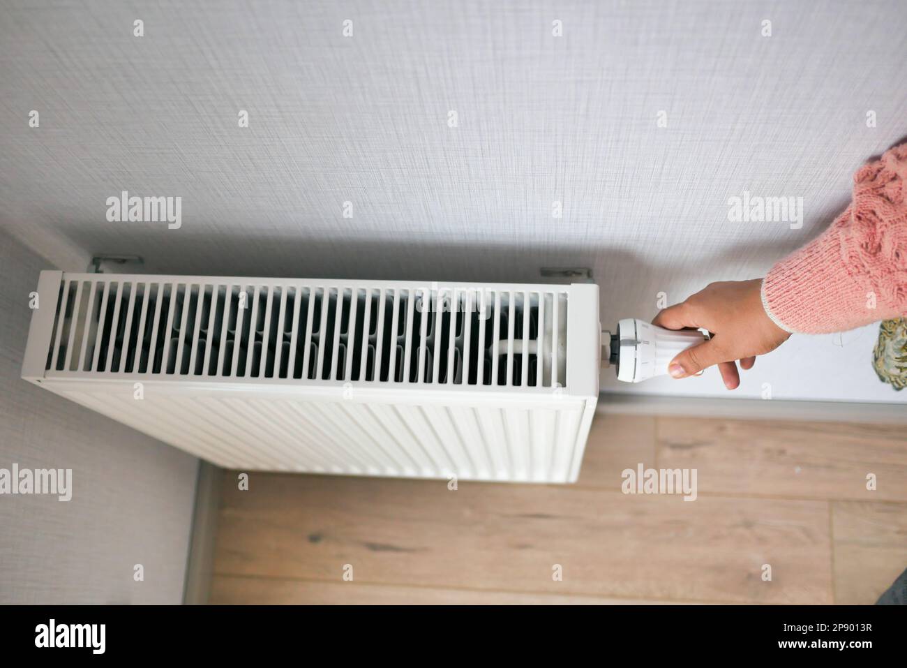 heating radiator under window in the room Stock Photo - Alamy