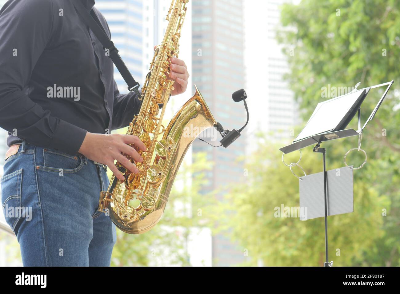 male's hands playing the saxophone outdoors Stock Photo - Alamy