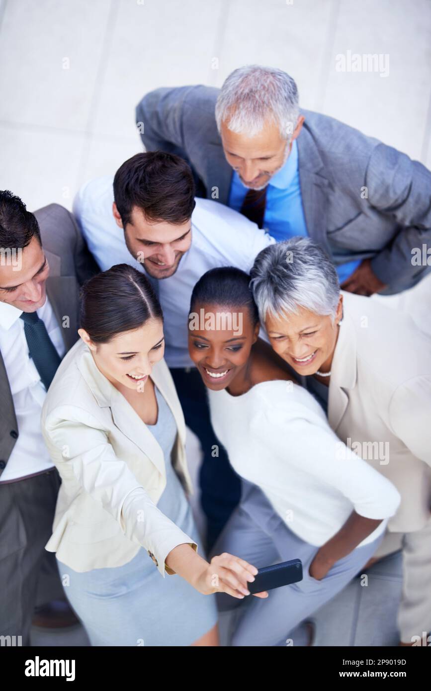 Team pose. a diverse group of businesspeople taking a team photo of ...