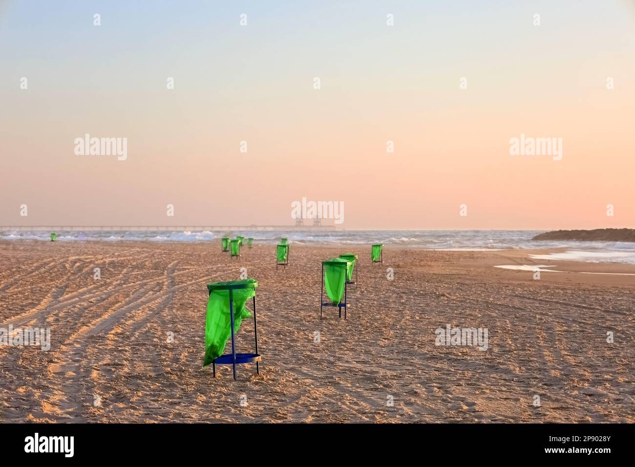 Garbage containers on sand near sea Stock Photo - Alamy