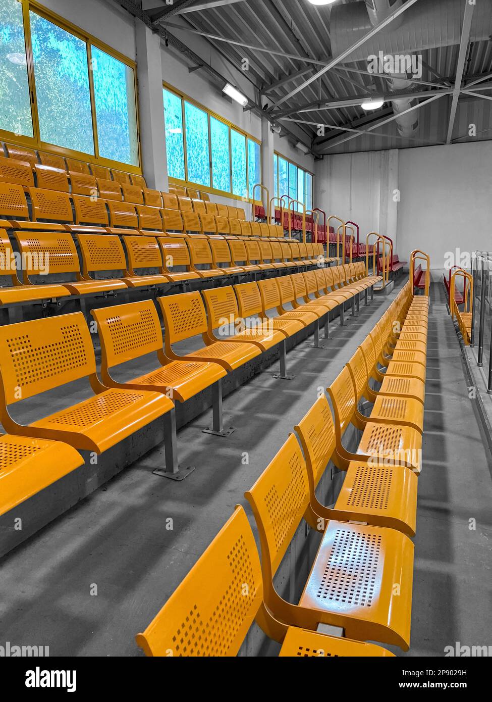 View of yellow seats in stadium Stock Photo - Alamy