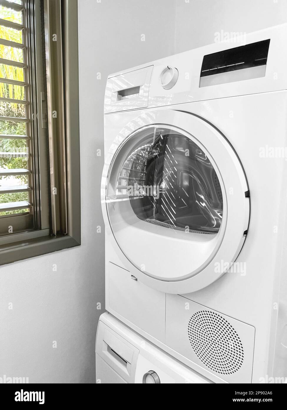 Modern washing machines in laundry room Stock Photo - Alamy