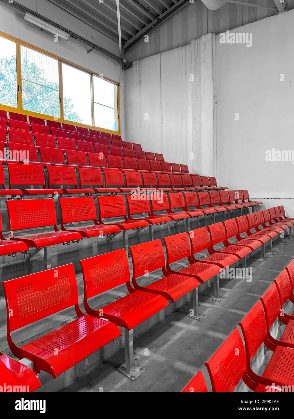 View of red seats in stadium Stock Photo - Alamy
