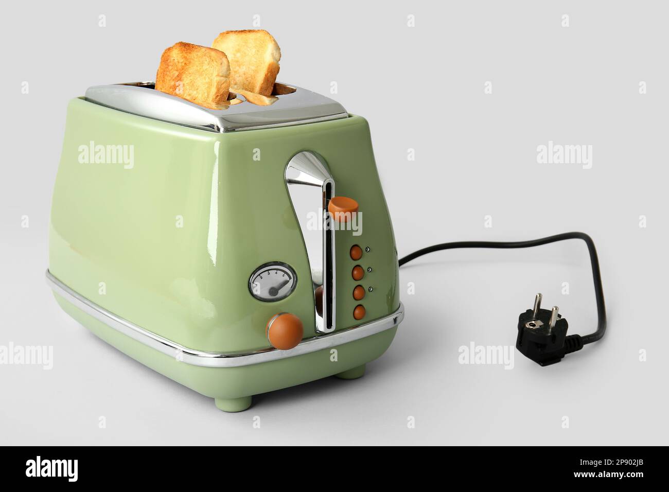 Modern toaster with crispy bread slices isolated on white background Stock Photo - Alamy