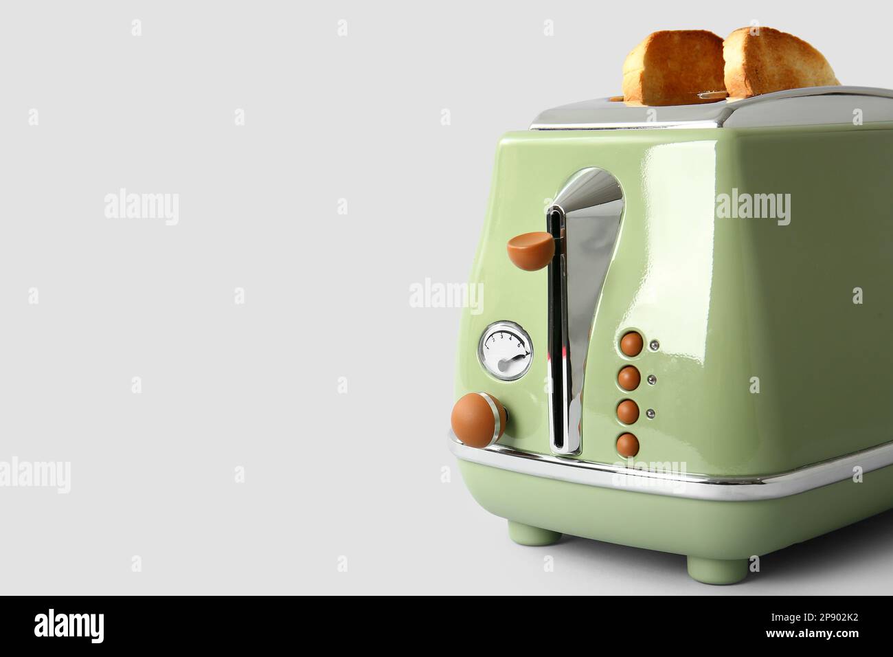 Modern toaster with crispy bread slices isolated on white background ...