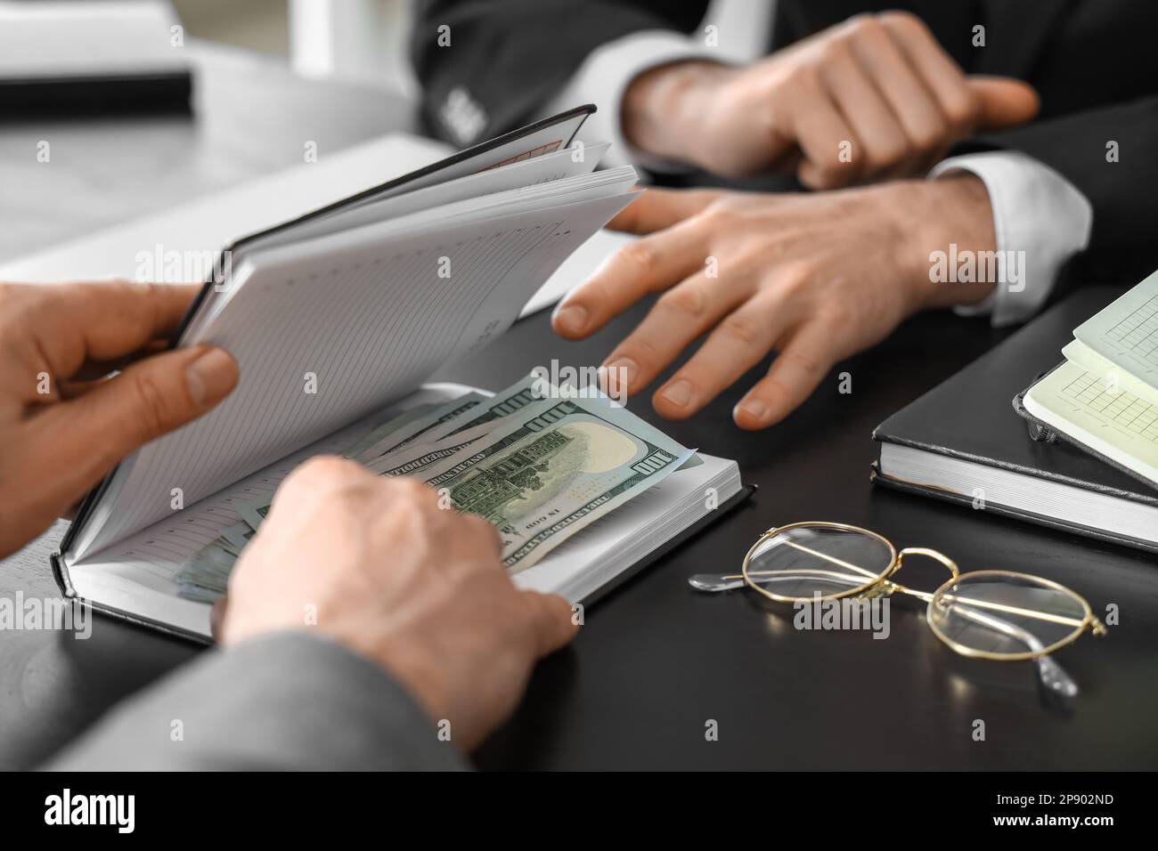 Mature man giving bribe hi-res stock photography and images - Alamy