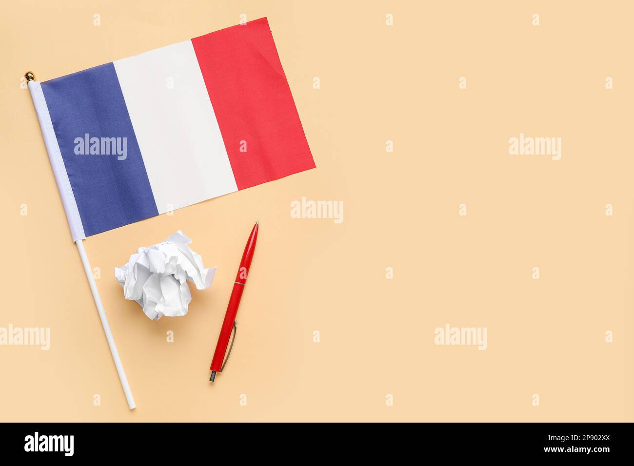 Flag of France with pen and crumpled paper on beige background Stock ...