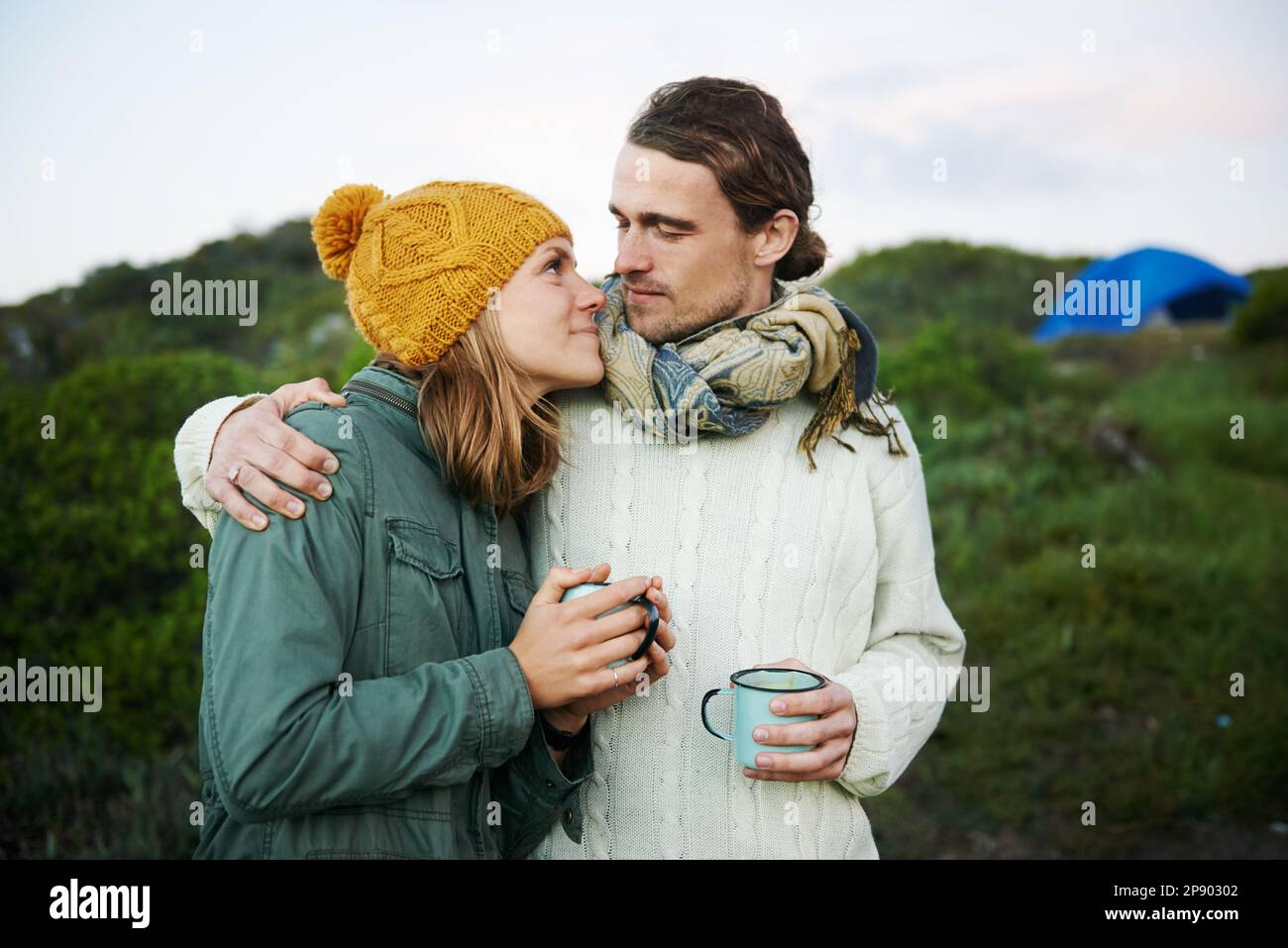 Getting lost in each others eyes. an affectionate young couple standing ...
