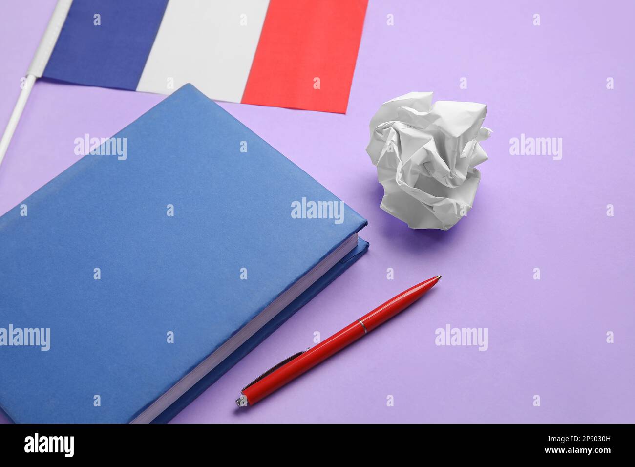 Flag of France with notebook, pen and crumpled paper on lilac ...