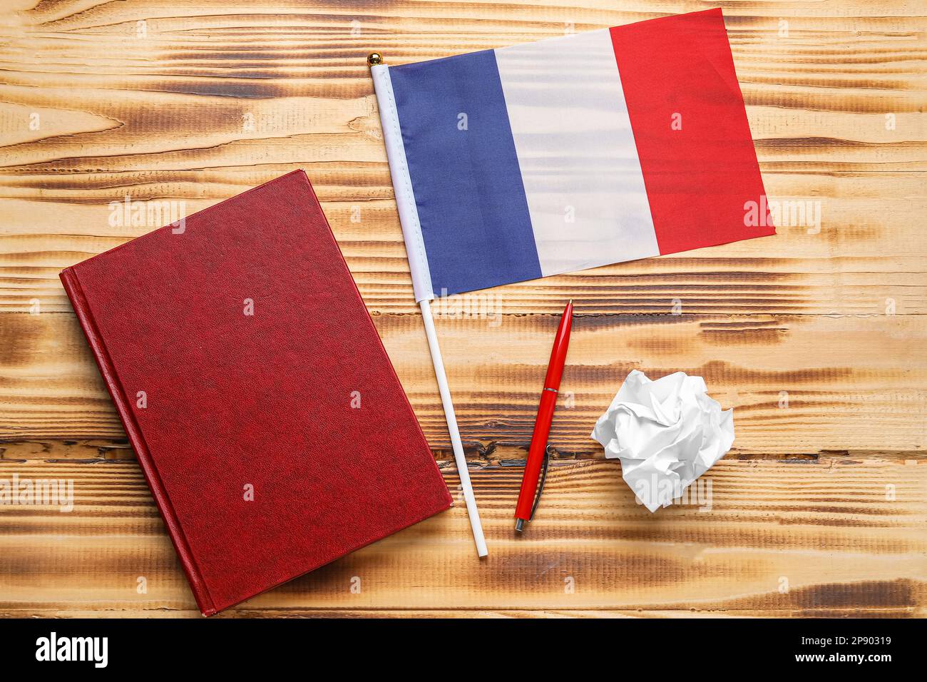 Flag of France with notebook, pen and crumpled paper on wooden ...