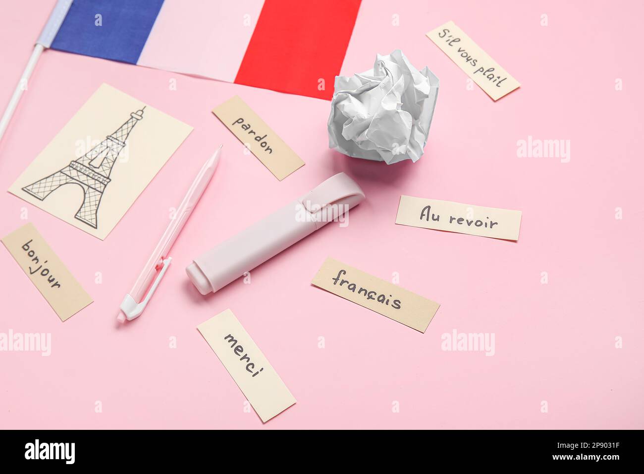 Flag of France with French words, drawn Eiffel Tower, pens and crumpled ...