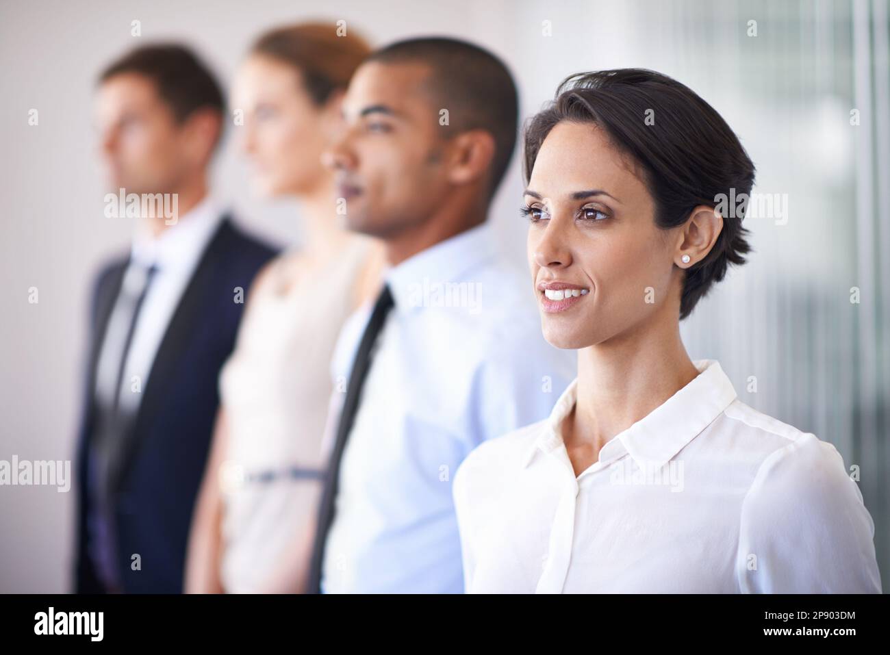 Standing with the best of her colleagues. a group of professional ...