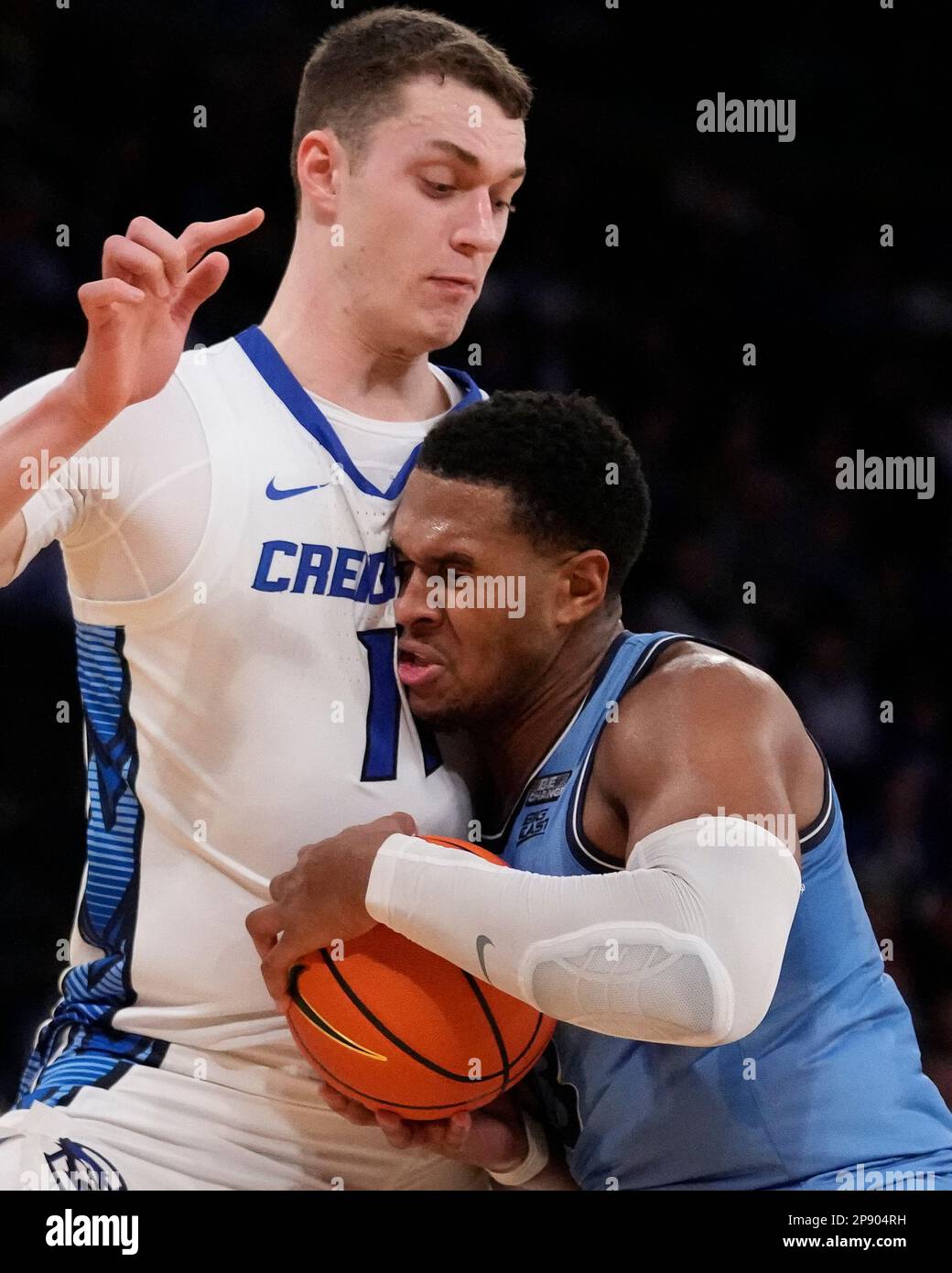 Villanova's Eric Dixon, right, collides with Creighton's Ryan ...