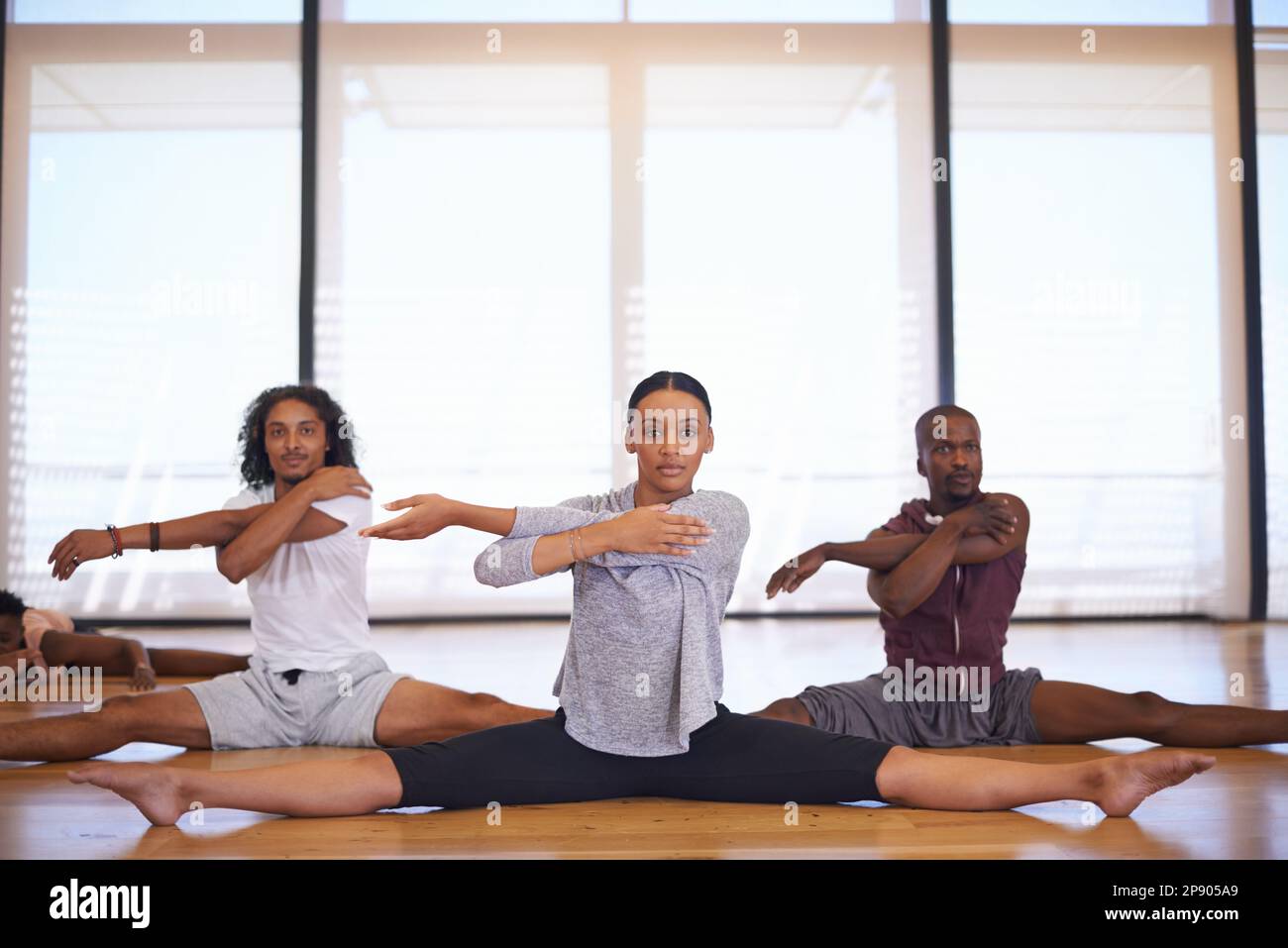 Making sure those muscles stay supple. a group of young dancers ...