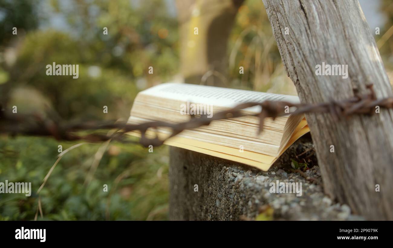 Freedom of idea and Reading Concept, Open Book and Rusty Barbed Wire ...