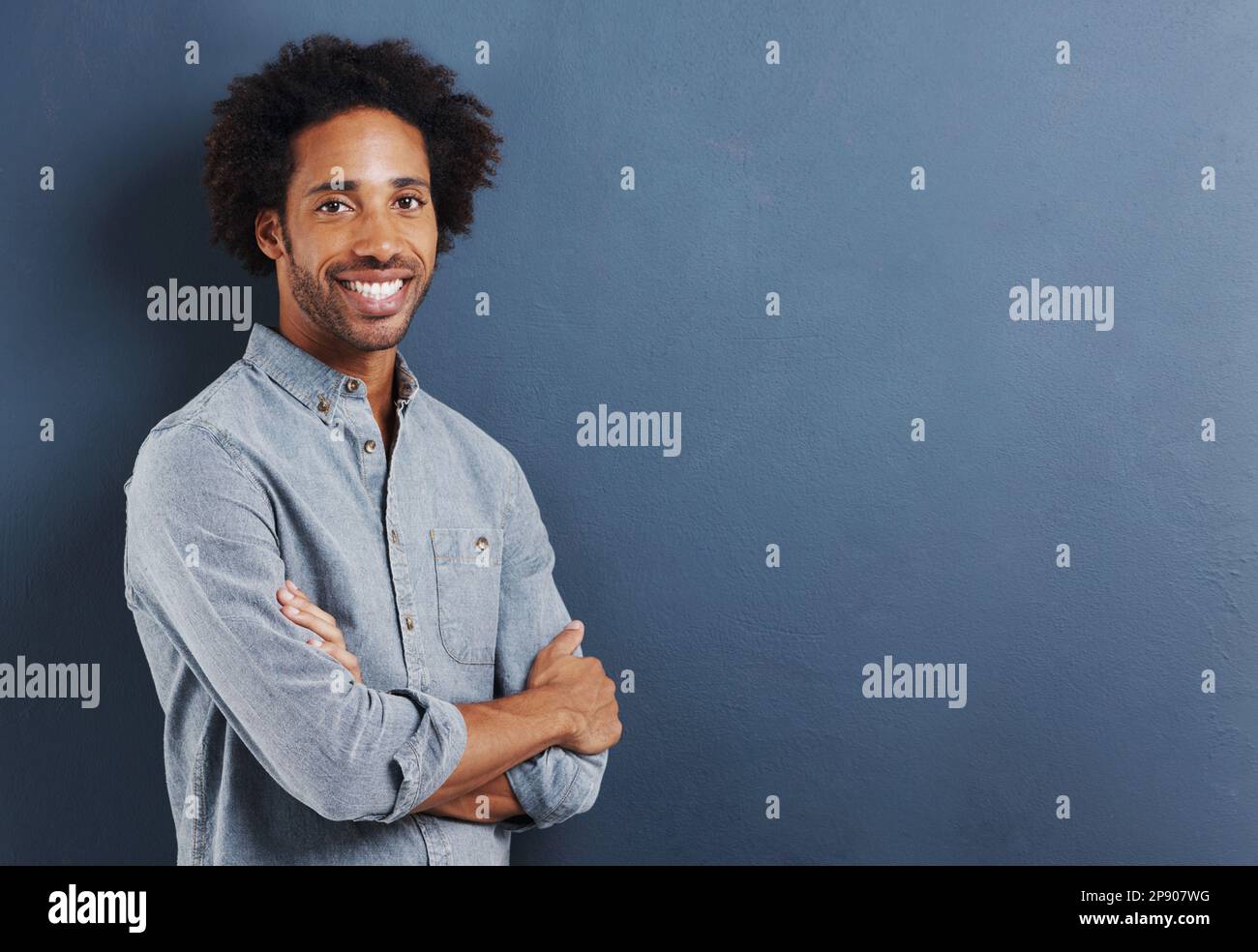 Confident and self-assured. Portrait of a handsome young man standing ...