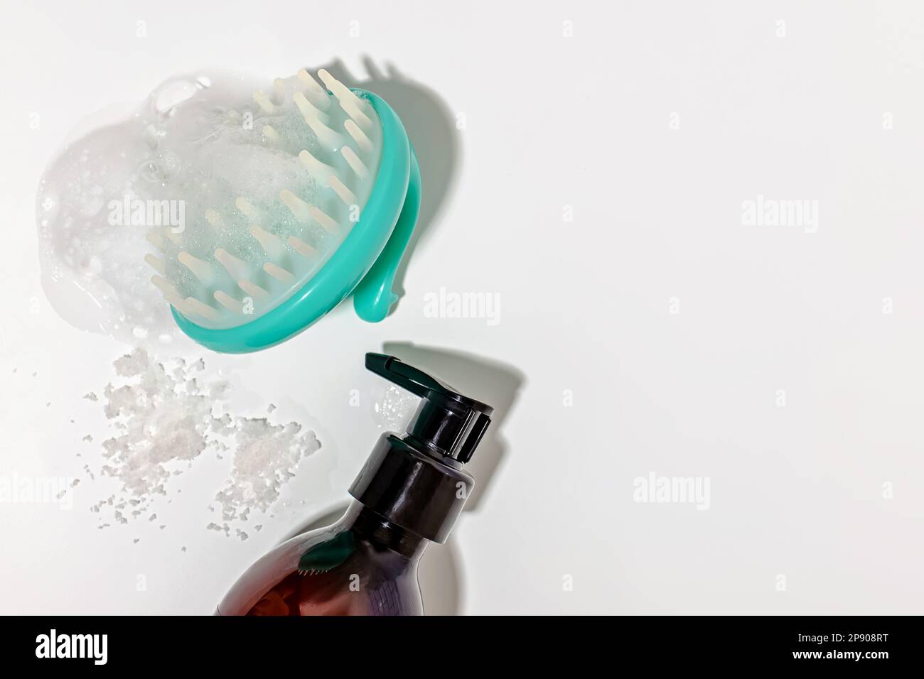 Hair brush for scalp massage and cleansing with foam, bottle of shampoo ...