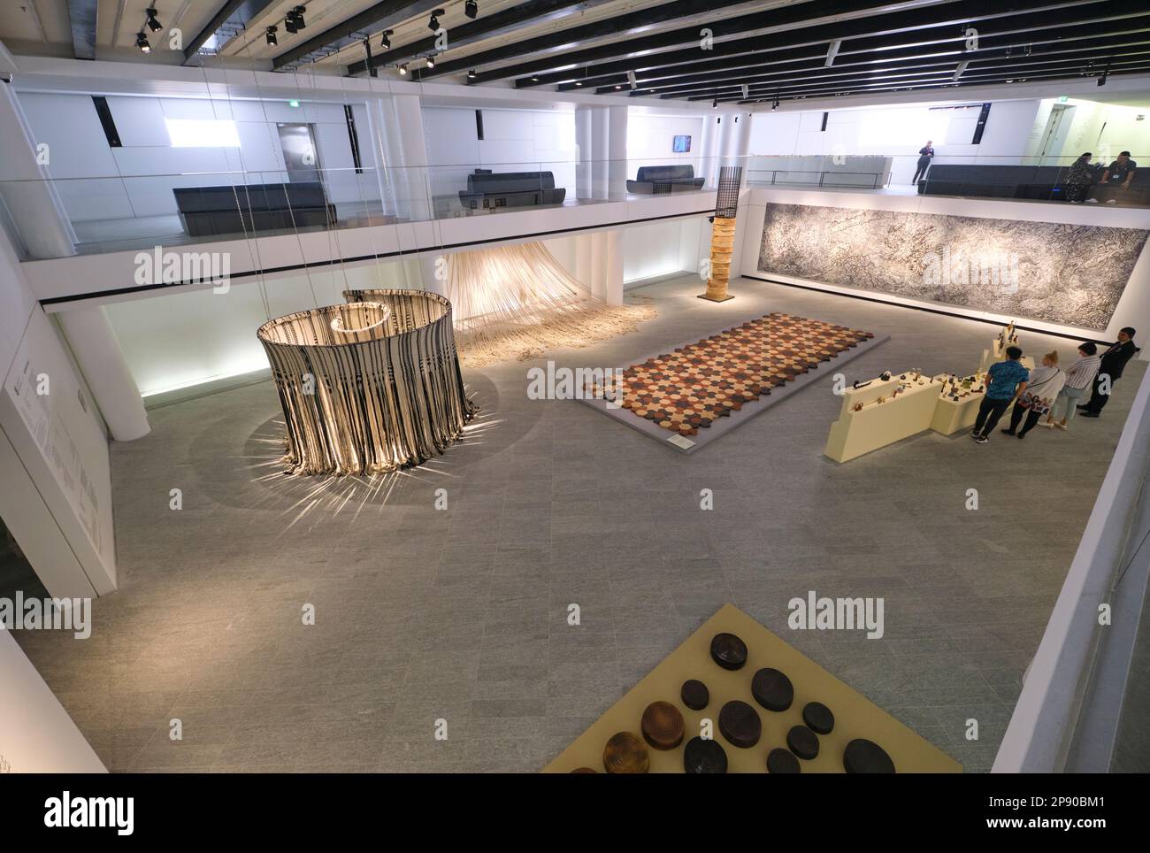 A downstairs, basement gallery room displaying a temporary group show ...