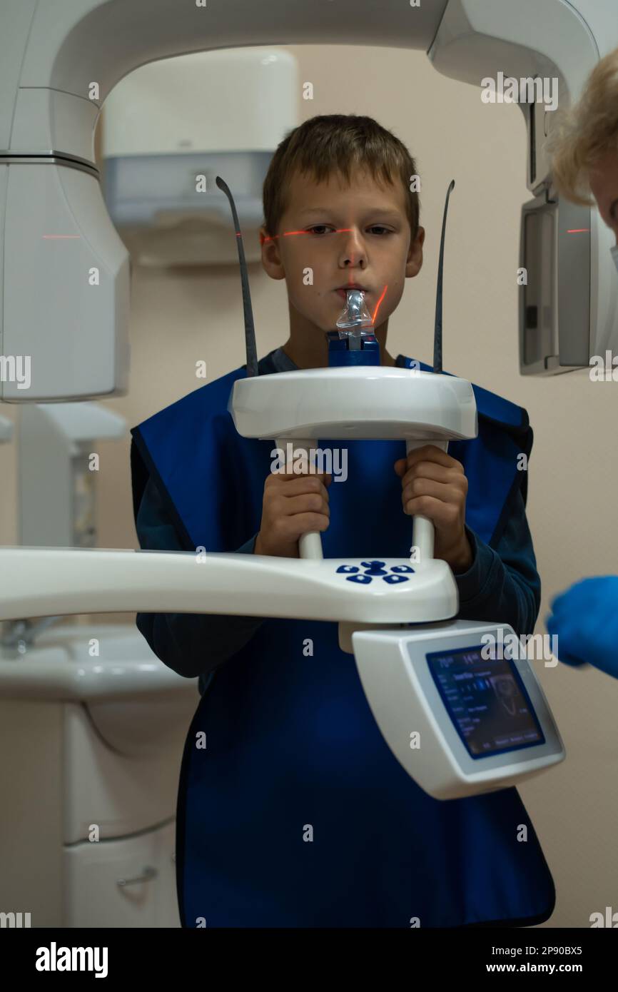 Jaw computed tomography, check up teeth in dental clinic. Little boy on ...