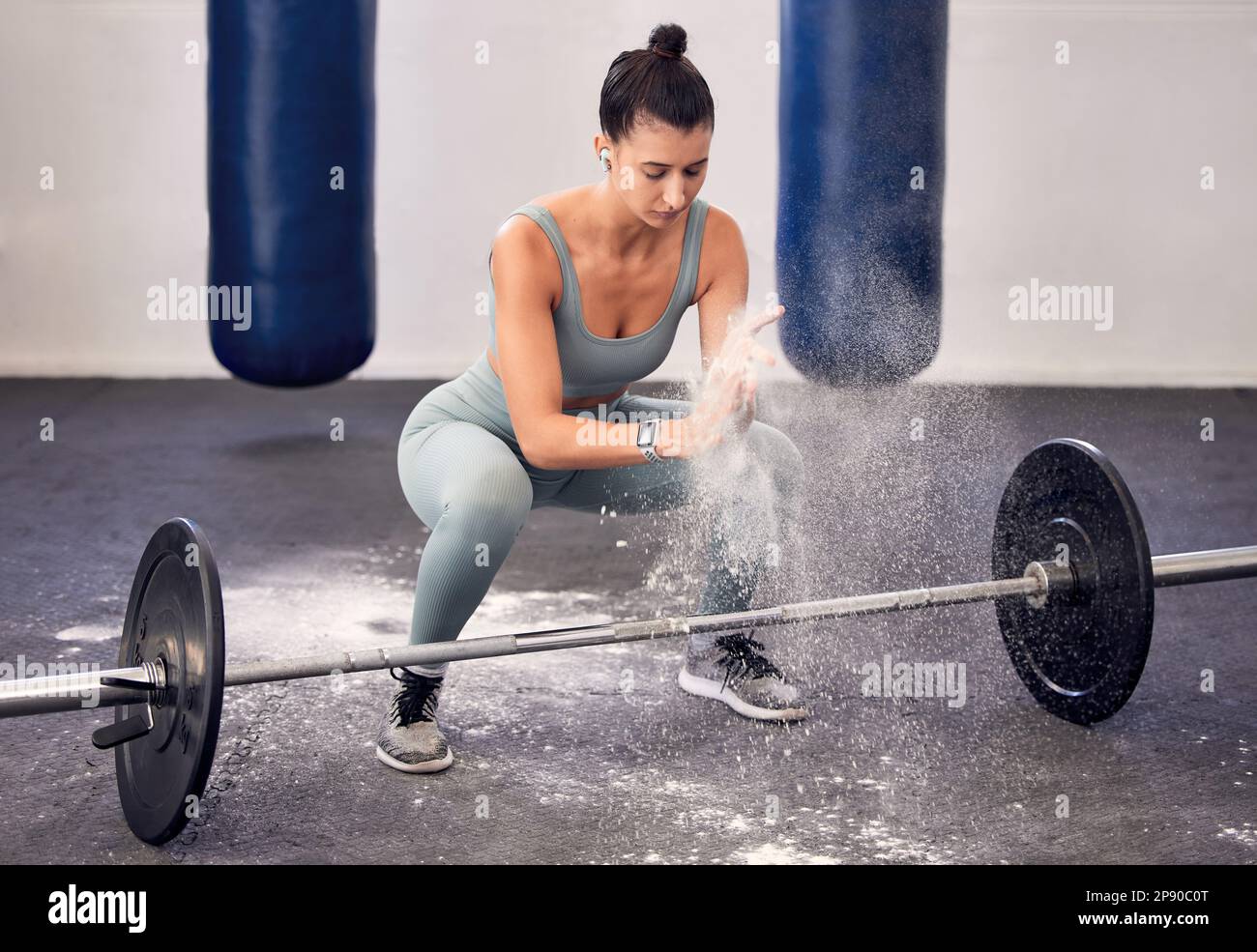 Woman, bodybuilder and powder in gym for barbell on hands for, safety ...